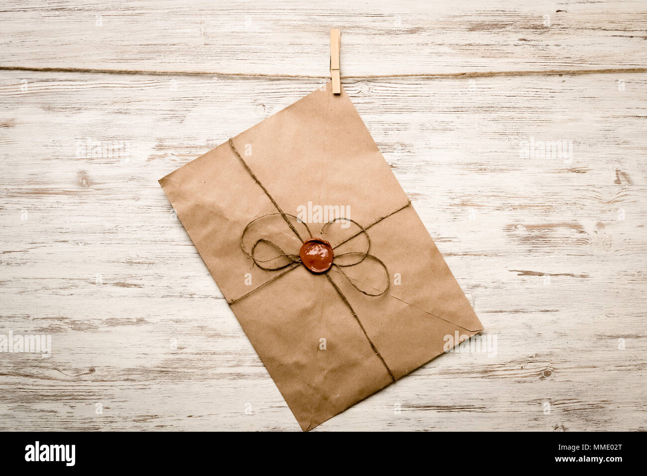 Mail envelope on rope Stock Photo - Alamy