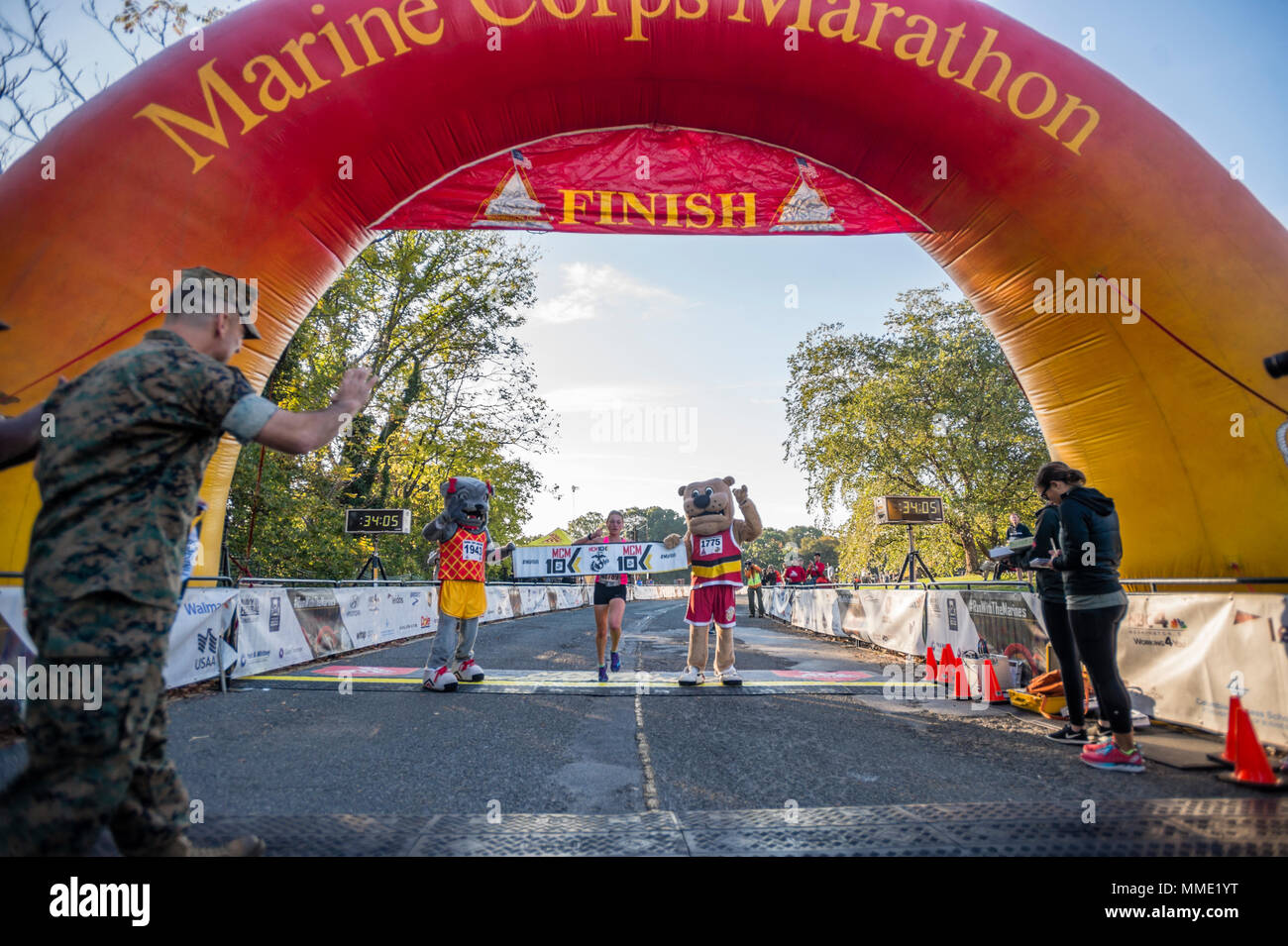 Sarah Bishop, Fairfax, Va., crosses the finish line as the first female ...