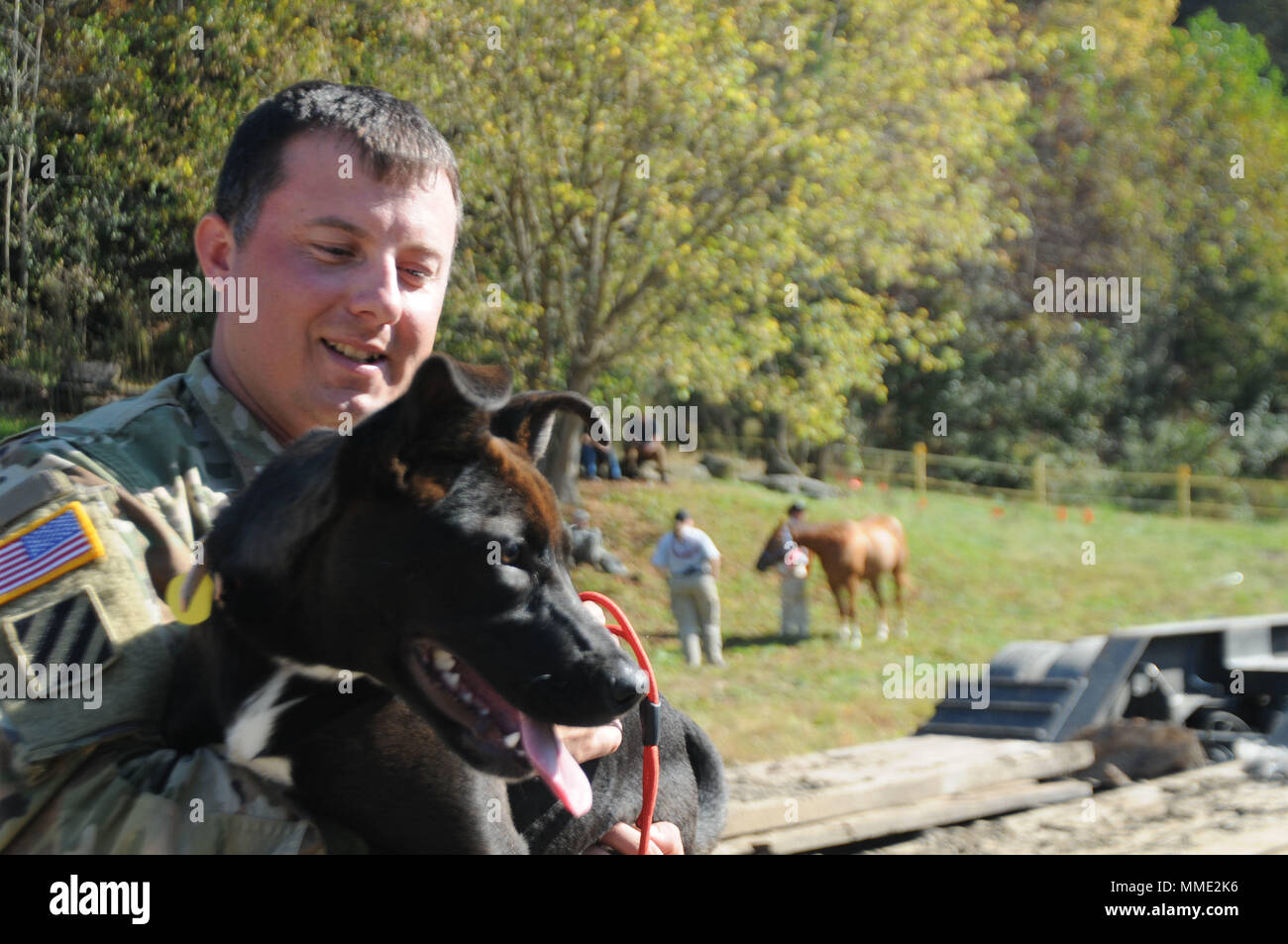 West Virginia National Guard Sgt. 1st Class Barry Moore interacts with ...