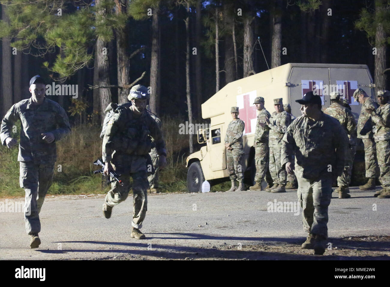 U.S. Army Soldiers participate in a twelve mile ruck march as part of ...