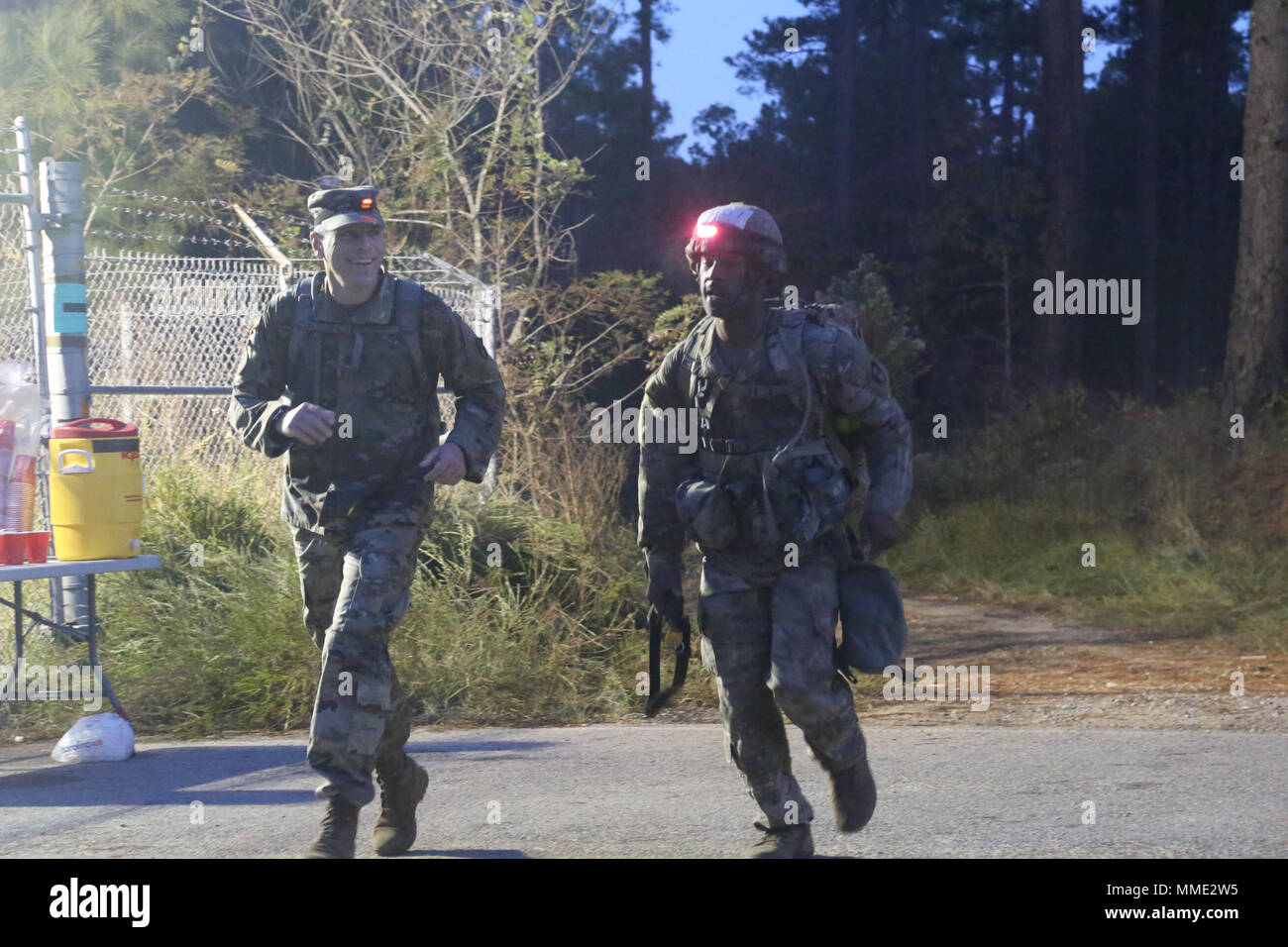 U.S. Army Soldiers participate in a twelve mile ruck march as part of ...