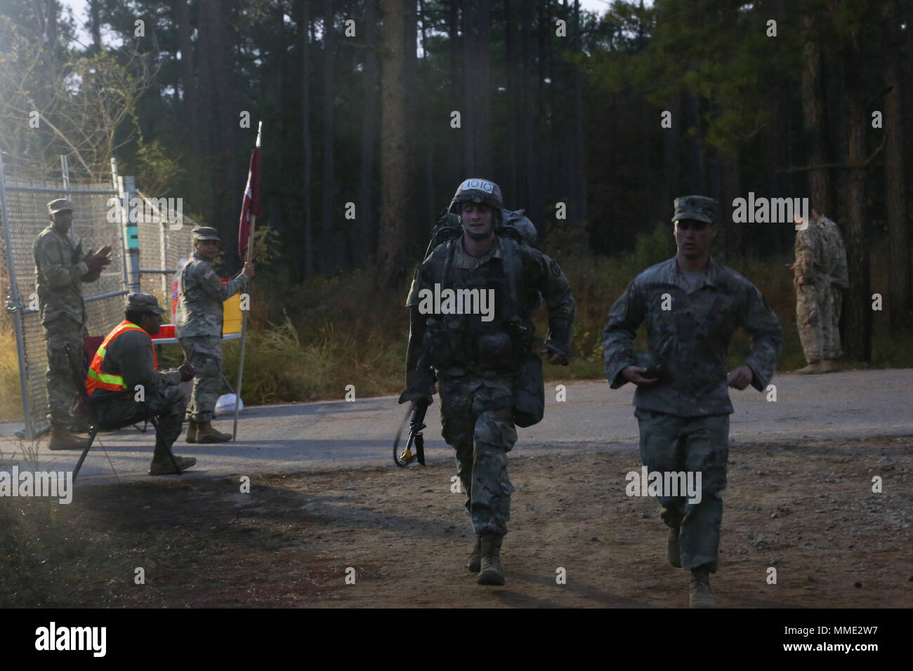 U.S. Army Soldiers participate in a twelve mile ruck march as part of ...