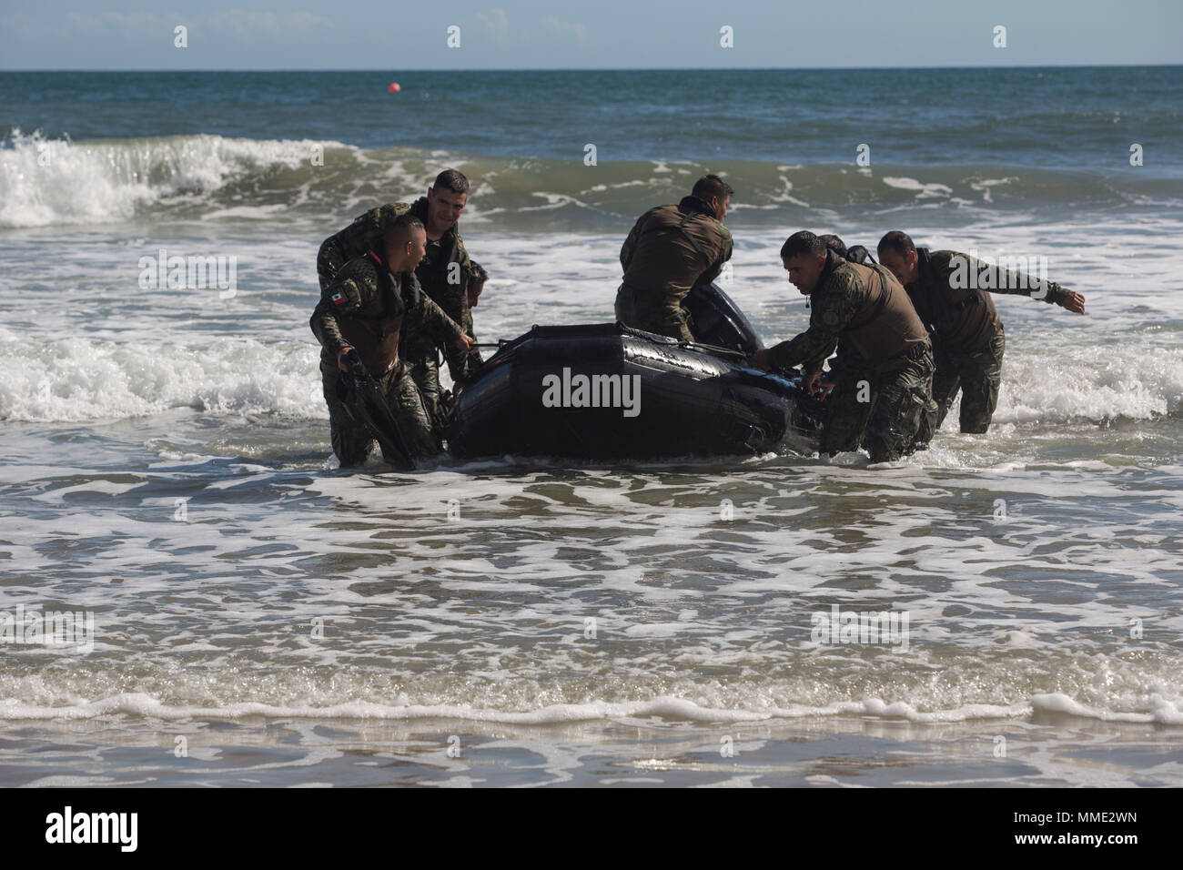 A team of Mexican Marines bring a Zodiac combat rubber raiding craft to ...