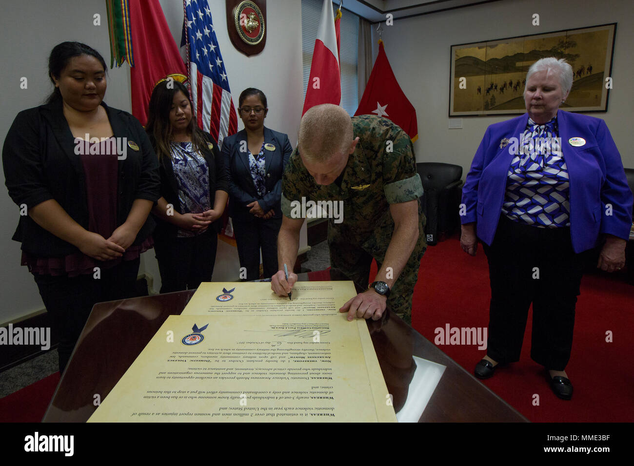 CAMP FOSTER, OKINAWA, Japan – Brig. Gen. Paul Rock Jr. signs the ...