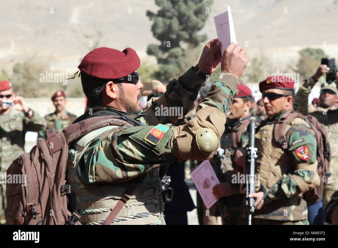 An Afghan National Army Special Operations Commando displays his ...