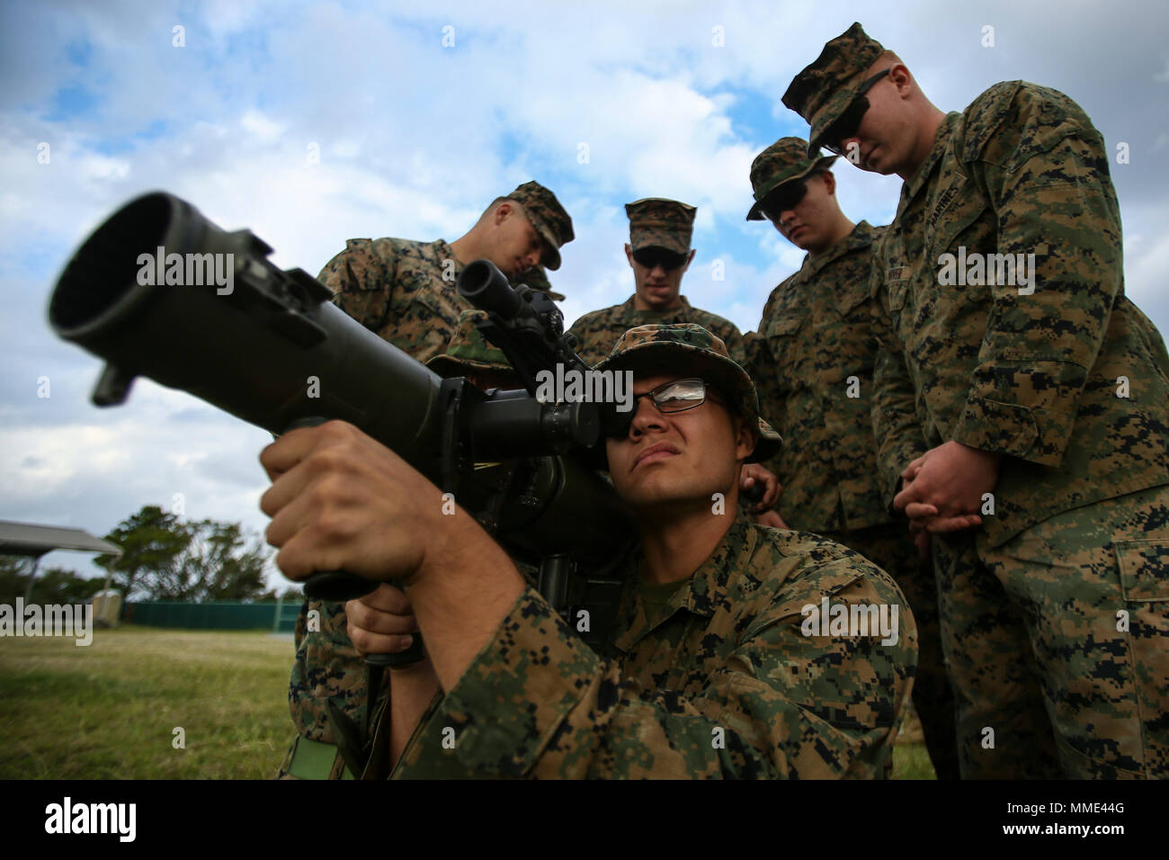 U.S. Marines observe a demonstration of the Carl Gustav rocket system ...