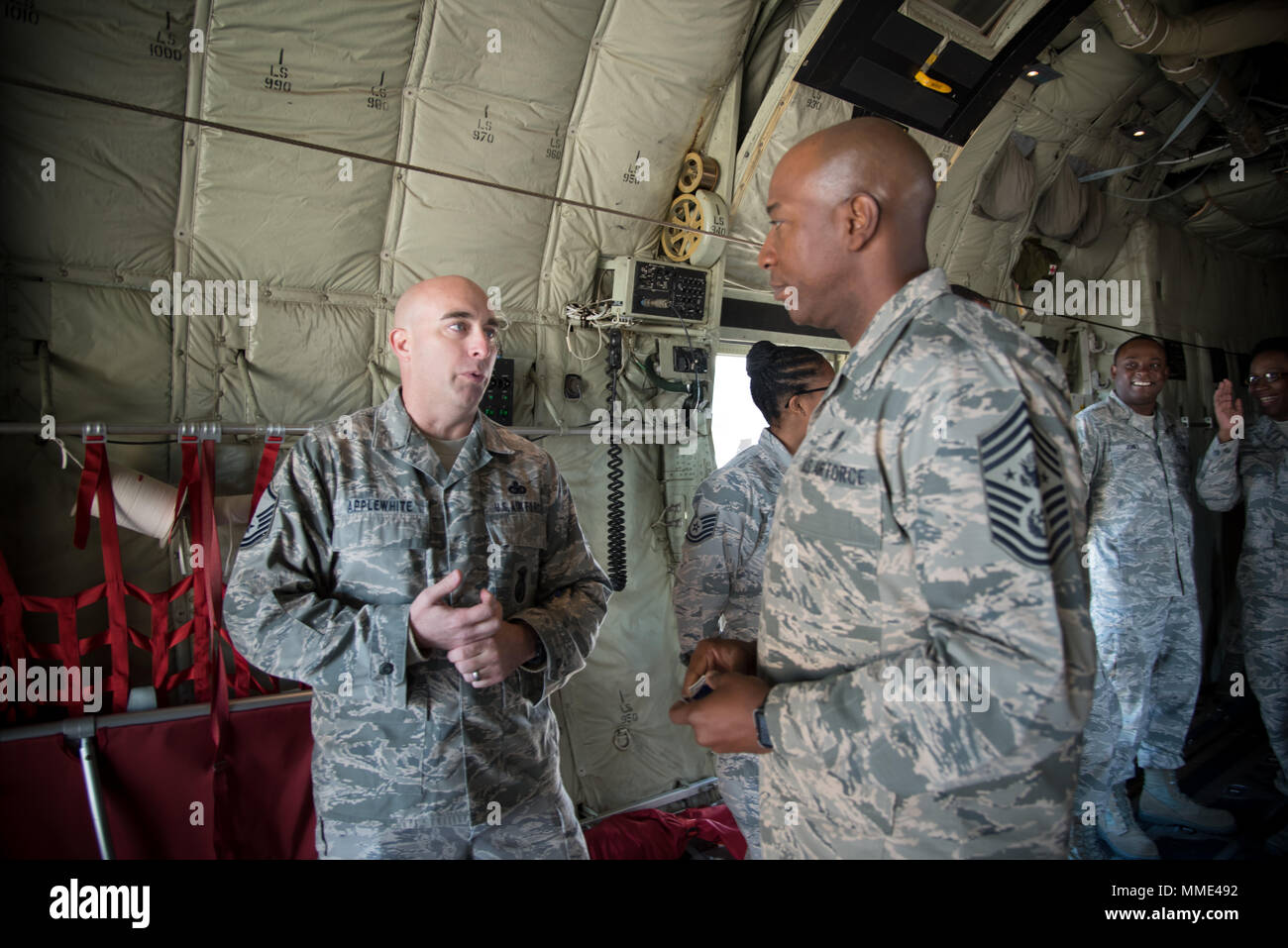 Chief Master Sergeant of the Air Force Kaleth O. Wright presents a coin ...