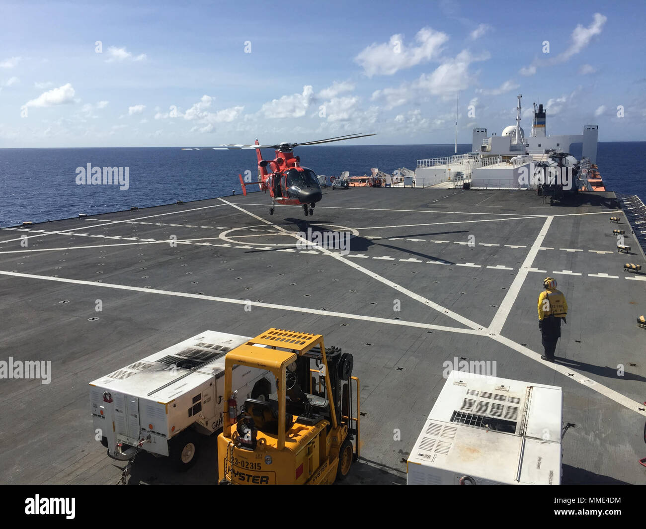 An HH-65 Dolphin helicopter crew from Coast Guard Air Station Borinquen ...