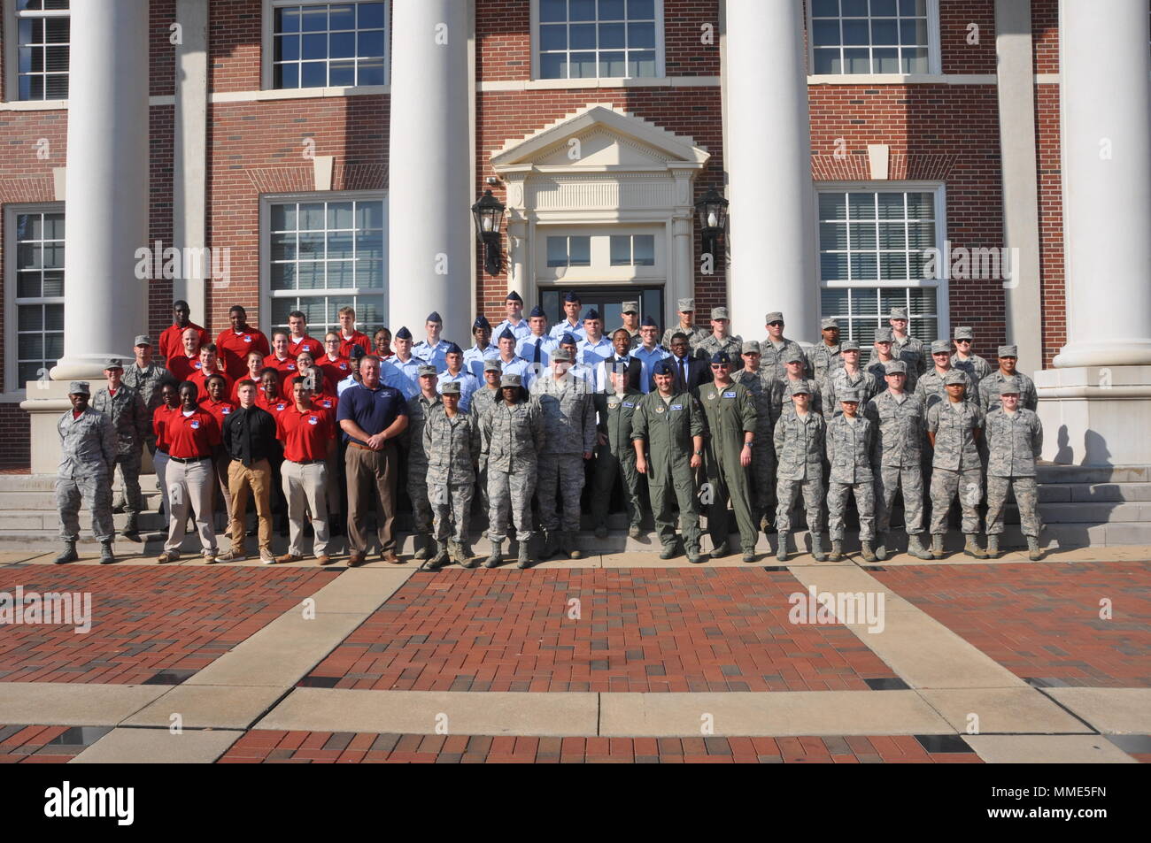 The cadets and facility of Air Force ROTC Detachment 017 pose with four ...