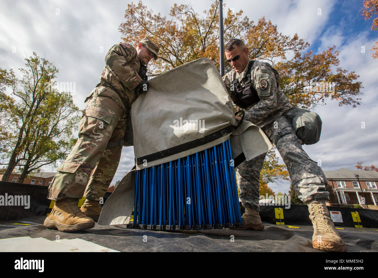 U.S. Army Staff Sgt. Kenneth Williams, left, and Maj. Ian A. Cairns ...