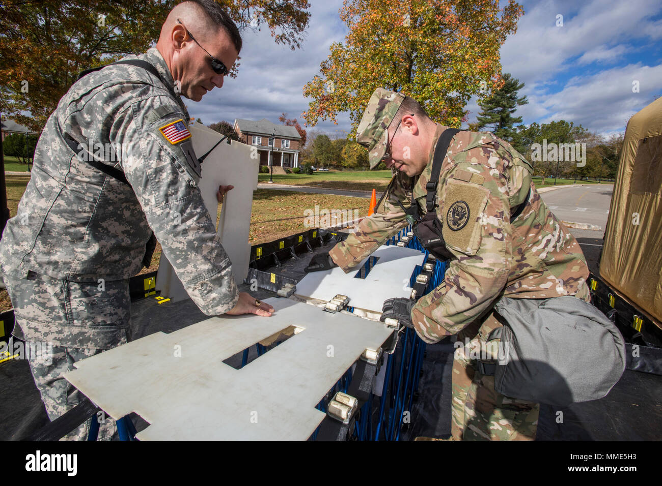 U.S. Army Maj. Ian A. Cairns, left, and Staff Sgt. Kenneth Williams ...