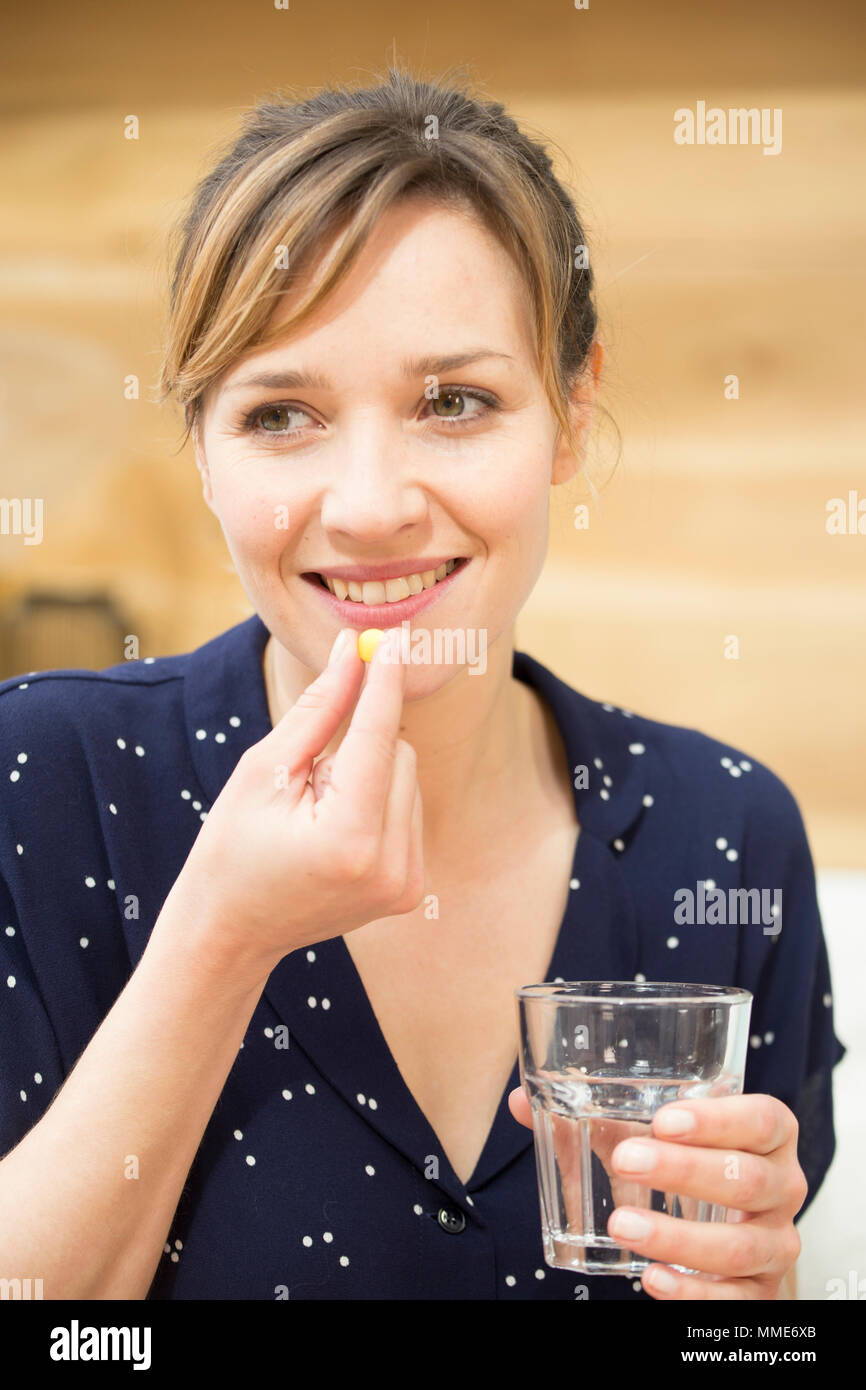 Woman 40 taking tablets hi-res stock photography and images - Alamy