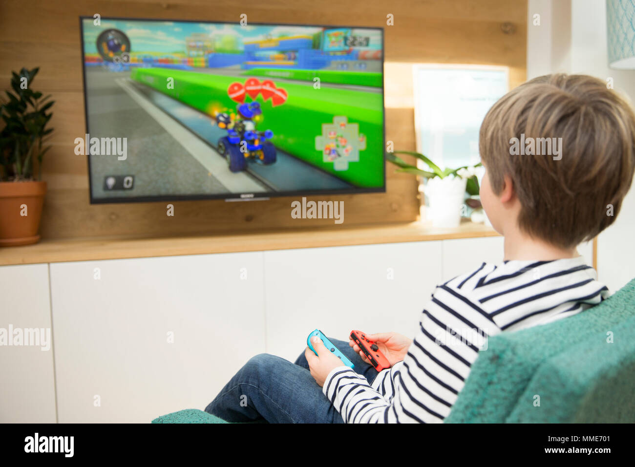 CHILD PLAYING VIDEO GAME Stock Photo - Alamy