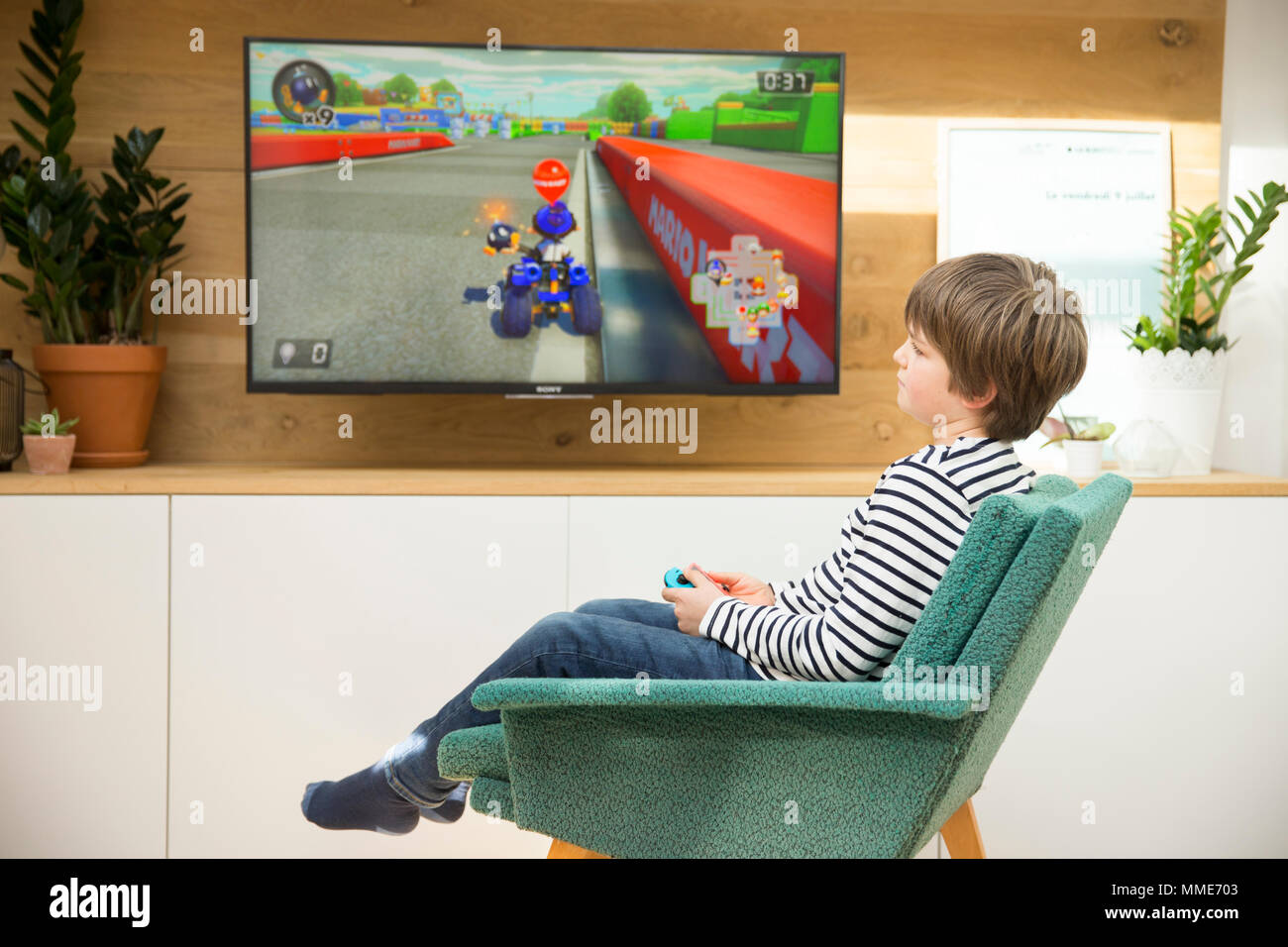 CHILD PLAYING VIDEO GAME Stock Photo - Alamy