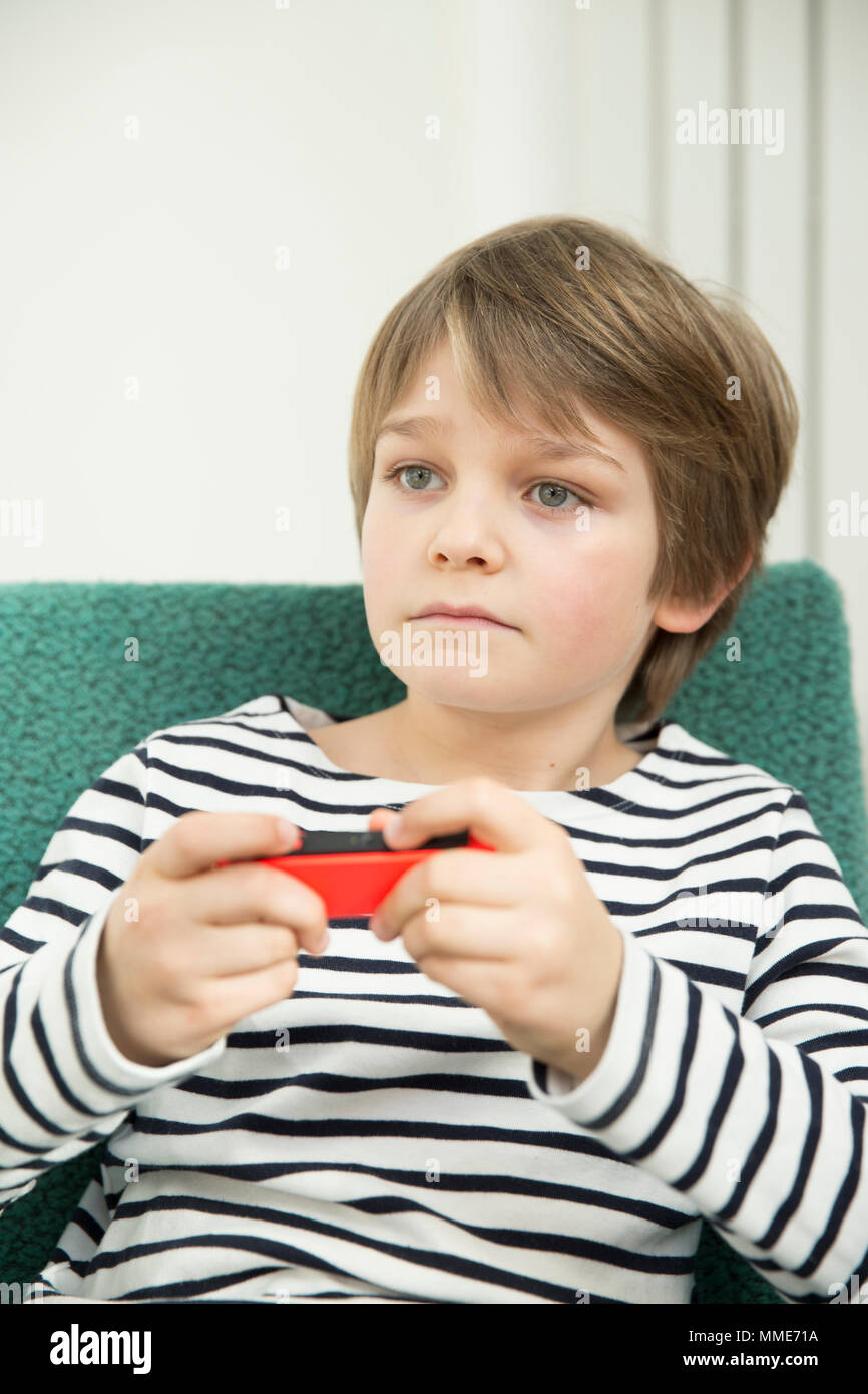CHILD PLAYING VIDEO GAME Stock Photo - Alamy