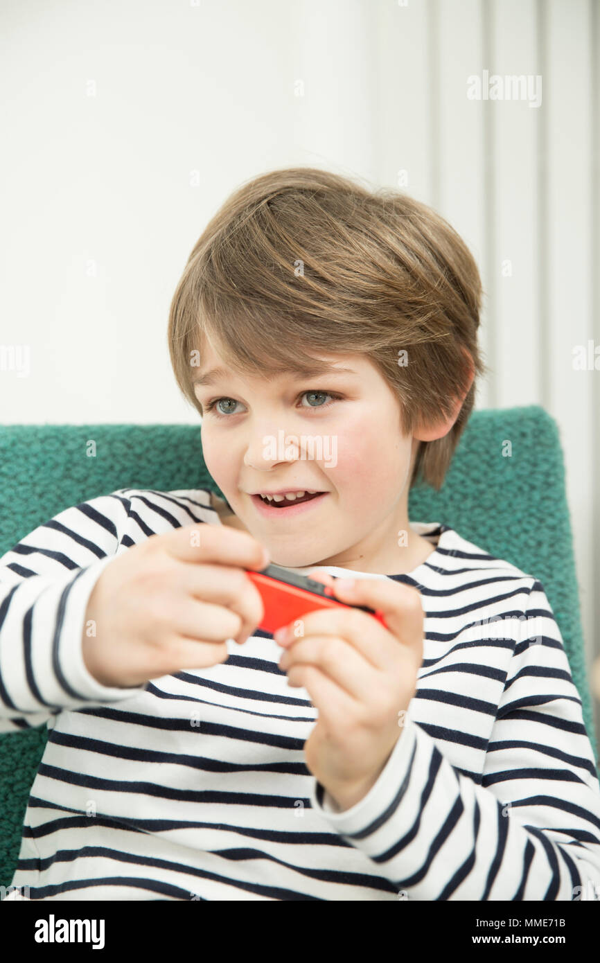 CHILD PLAYING VIDEO GAME Stock Photo - Alamy