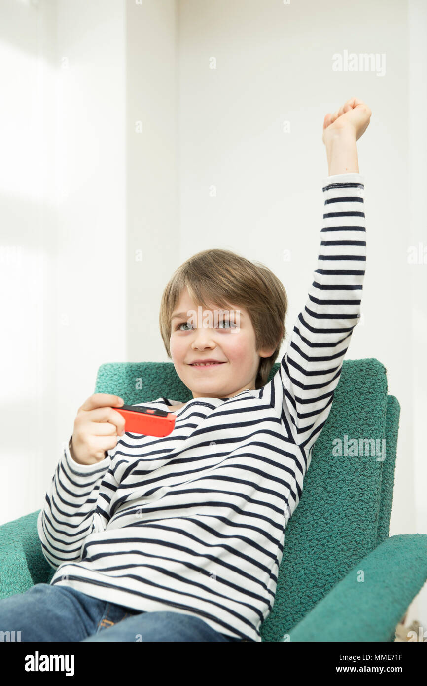CHILD PLAYING VIDEO GAME Stock Photo - Alamy