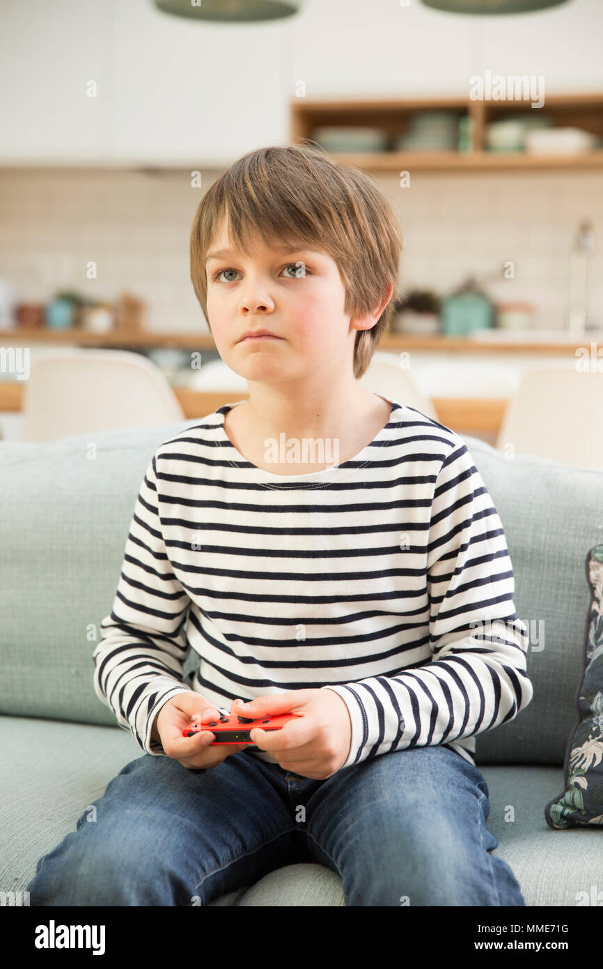 CHILD PLAYING VIDEO GAME Stock Photo - Alamy