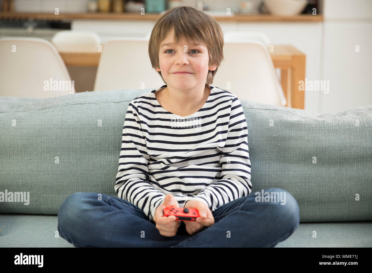 CHILD PLAYING VIDEO GAME Stock Photo - Alamy