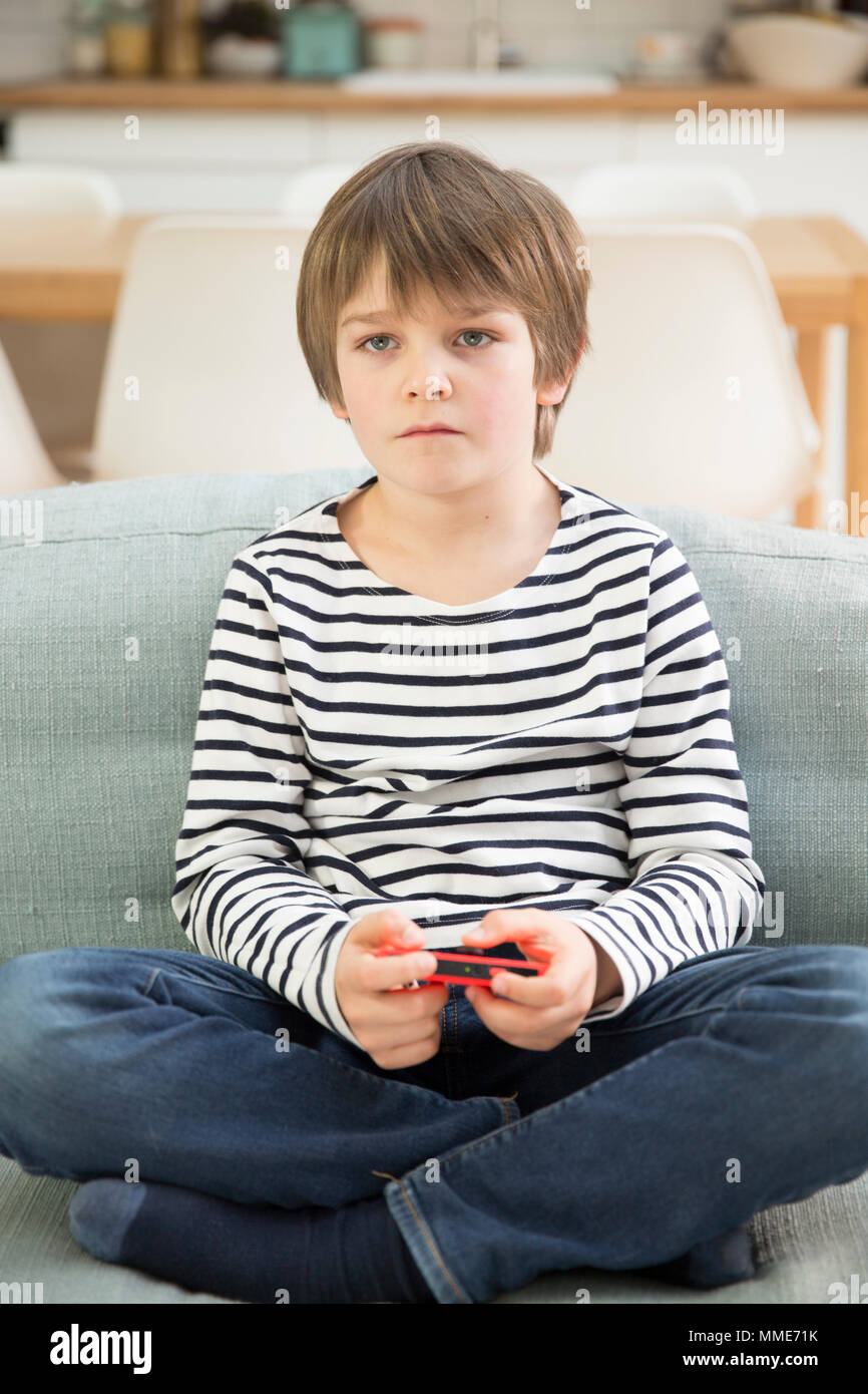 CHILD PLAYING VIDEO GAME Stock Photo - Alamy