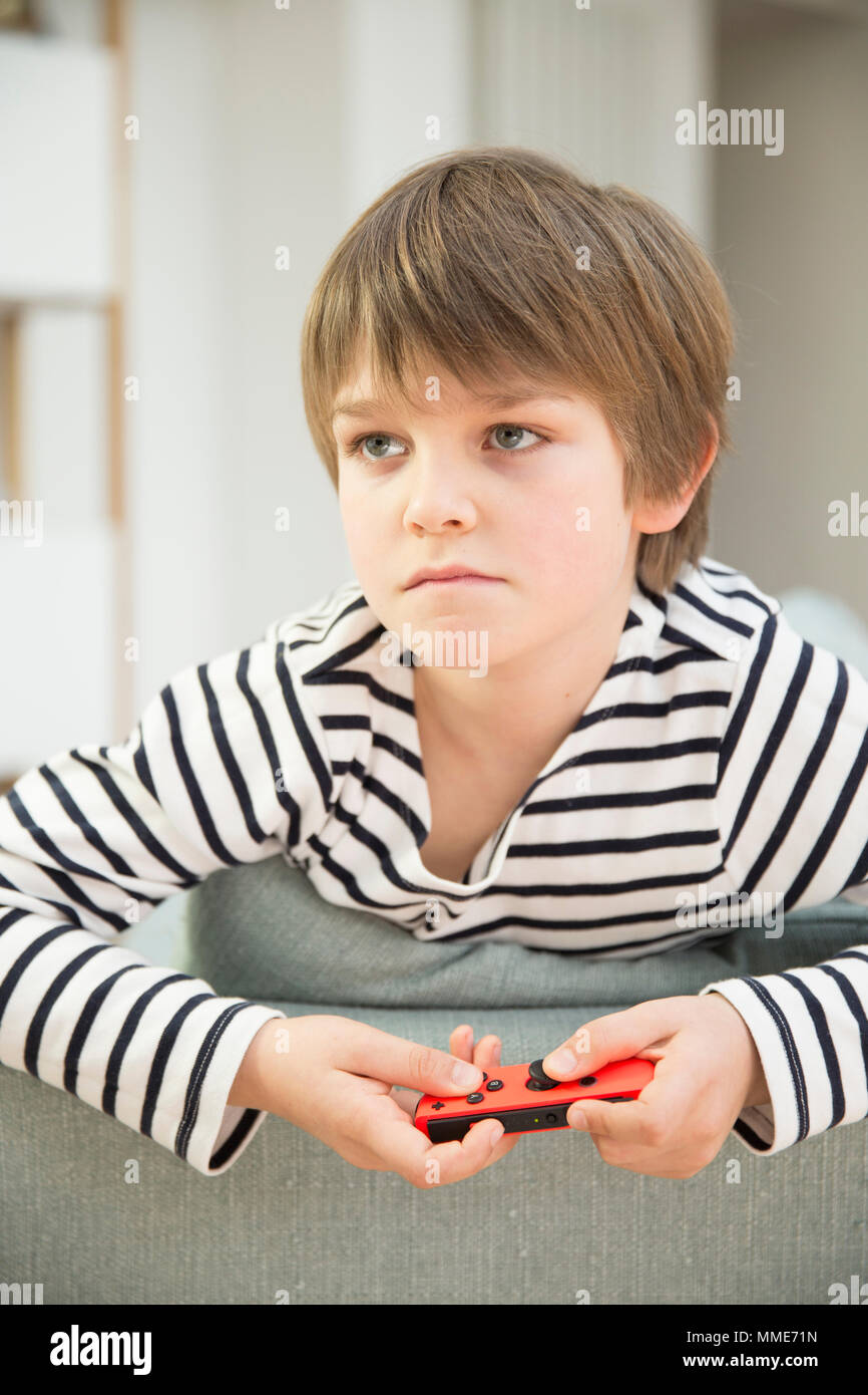 CHILD PLAYING VIDEO GAME Stock Photo - Alamy
