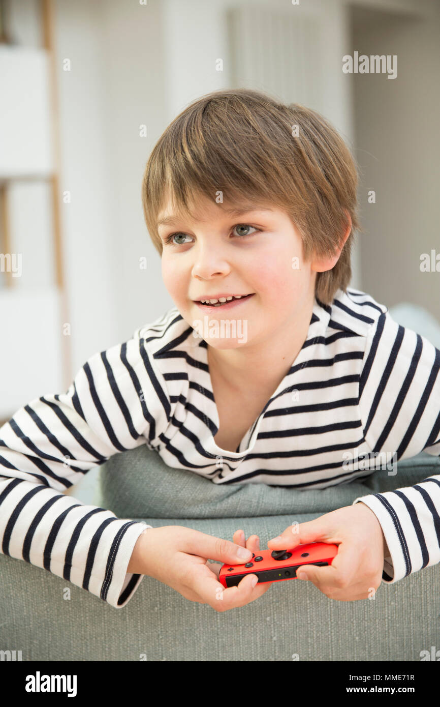 CHILD PLAYING VIDEO GAME Stock Photo - Alamy