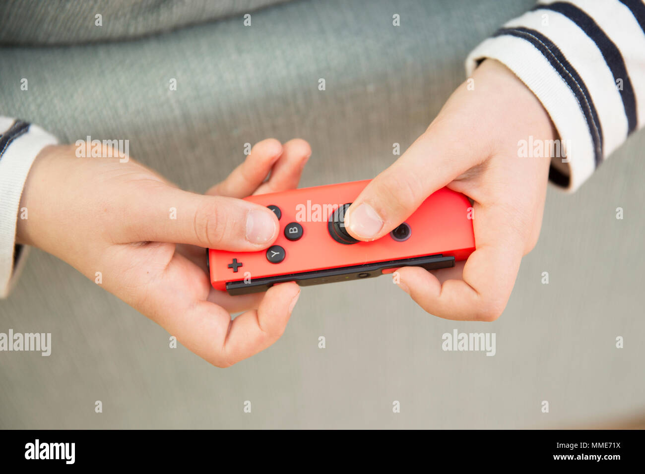 Child playing nintendo switch hi-res stock photography and images - Alamy