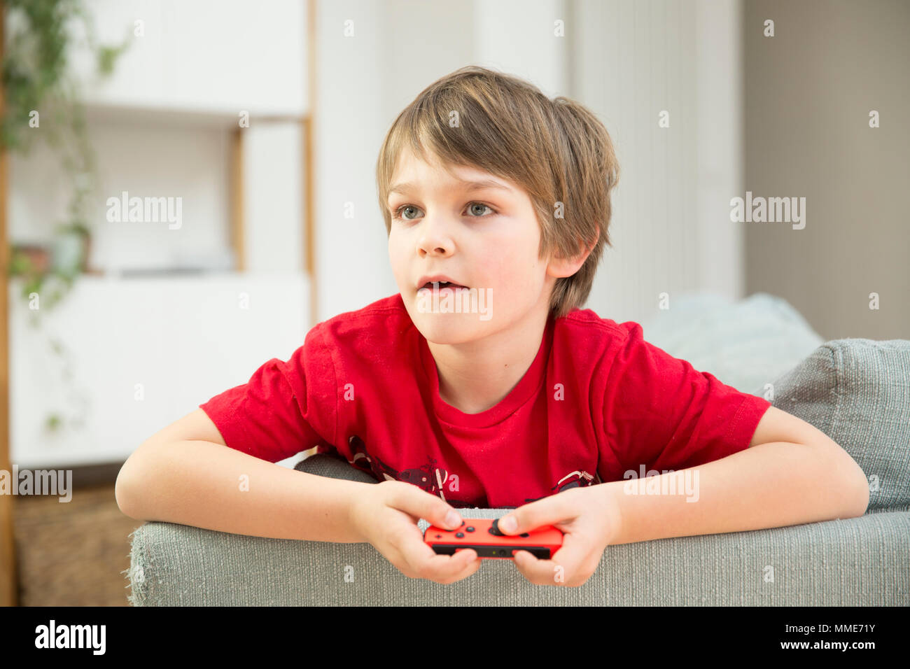 Child playing nintendo switch hi-res stock photography and images - Alamy