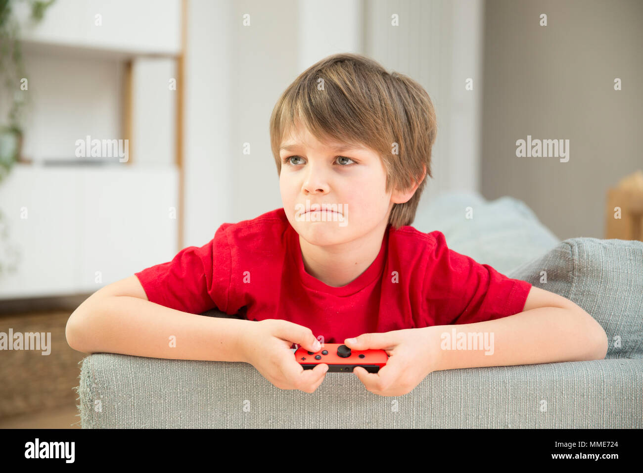 Child playing nintendo switch hi-res stock photography and images - Alamy