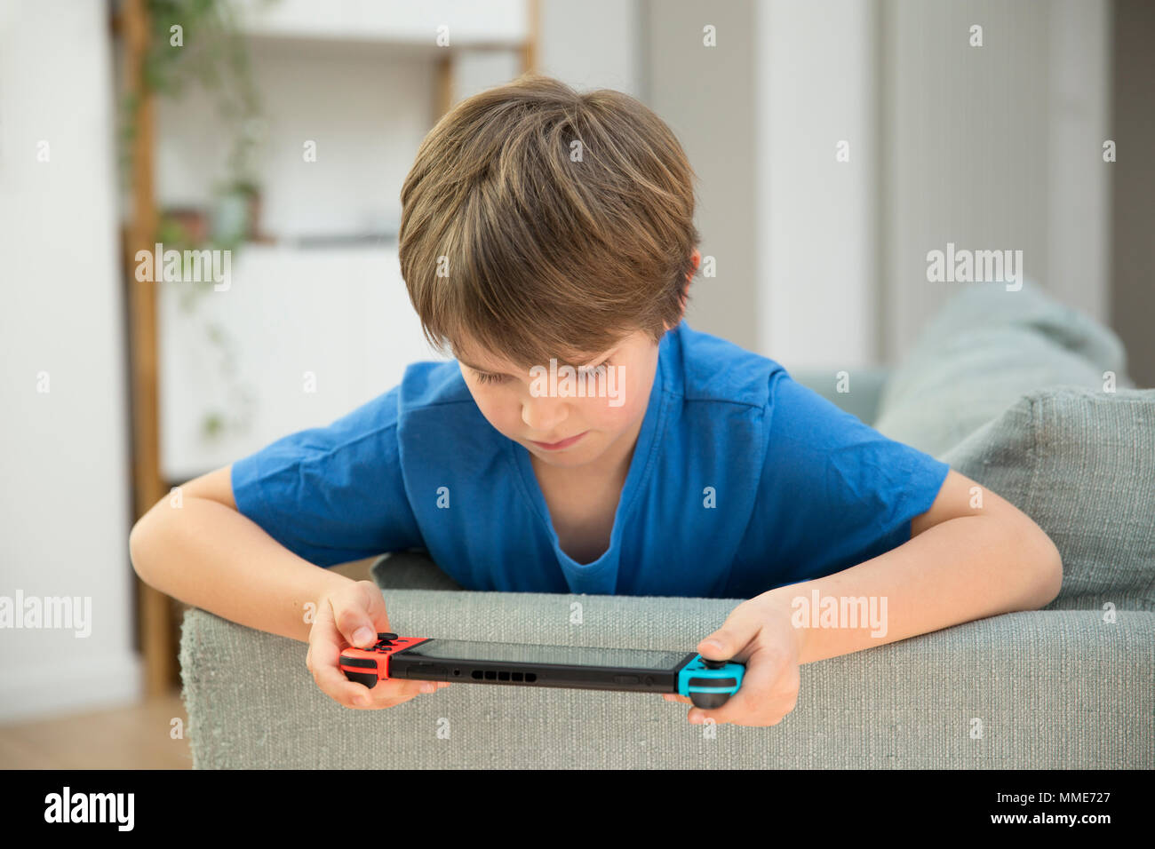 CHILD PLAYING VIDEO GAME Stock Photo - Alamy