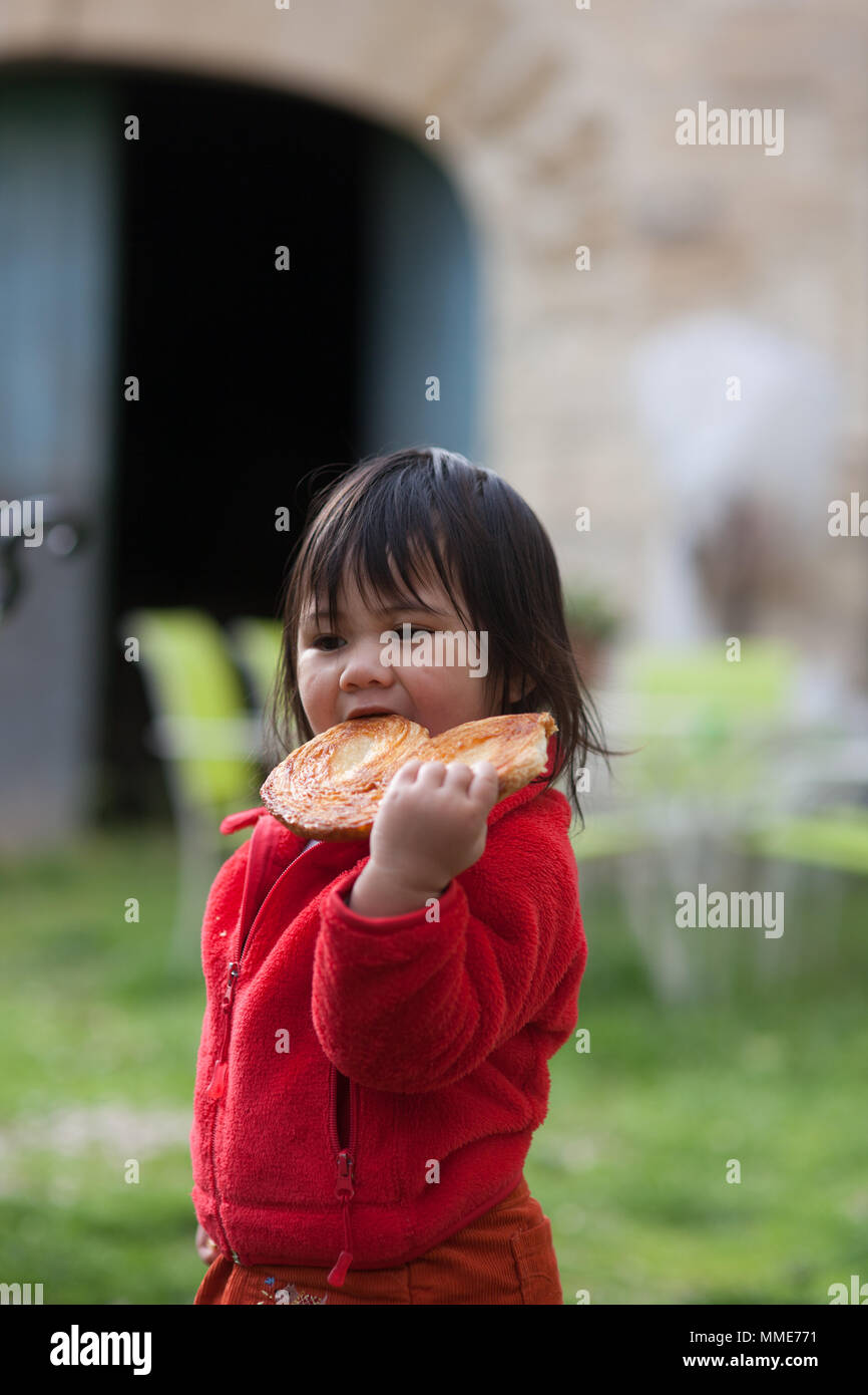 Child eating biscuits hi-res stock photography and images - Alamy