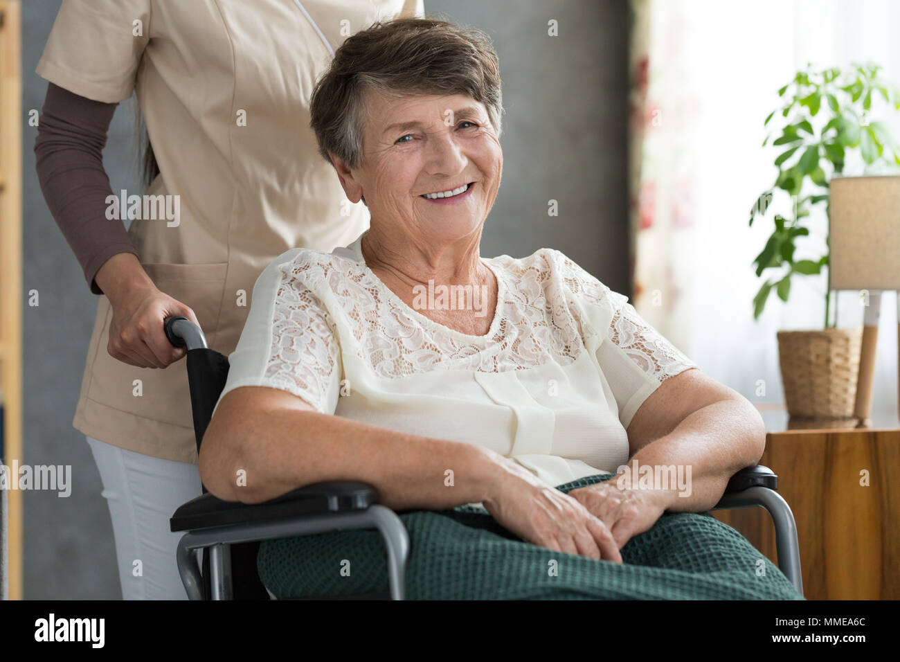 Close-up photo of happy senior lady in a wheelchair feeling better ...