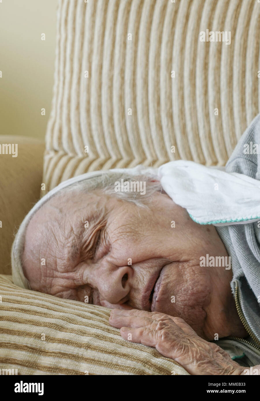 Elderly woman asleep on sofa hi-res stock photography and images - Alamy