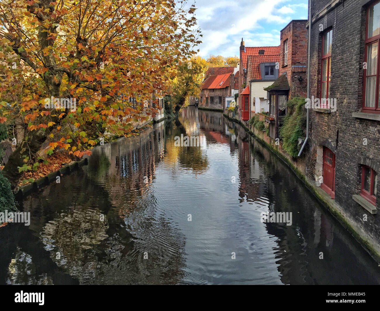 Canal of Bruges that surrounded by historical houses in Belgium, Europe ...