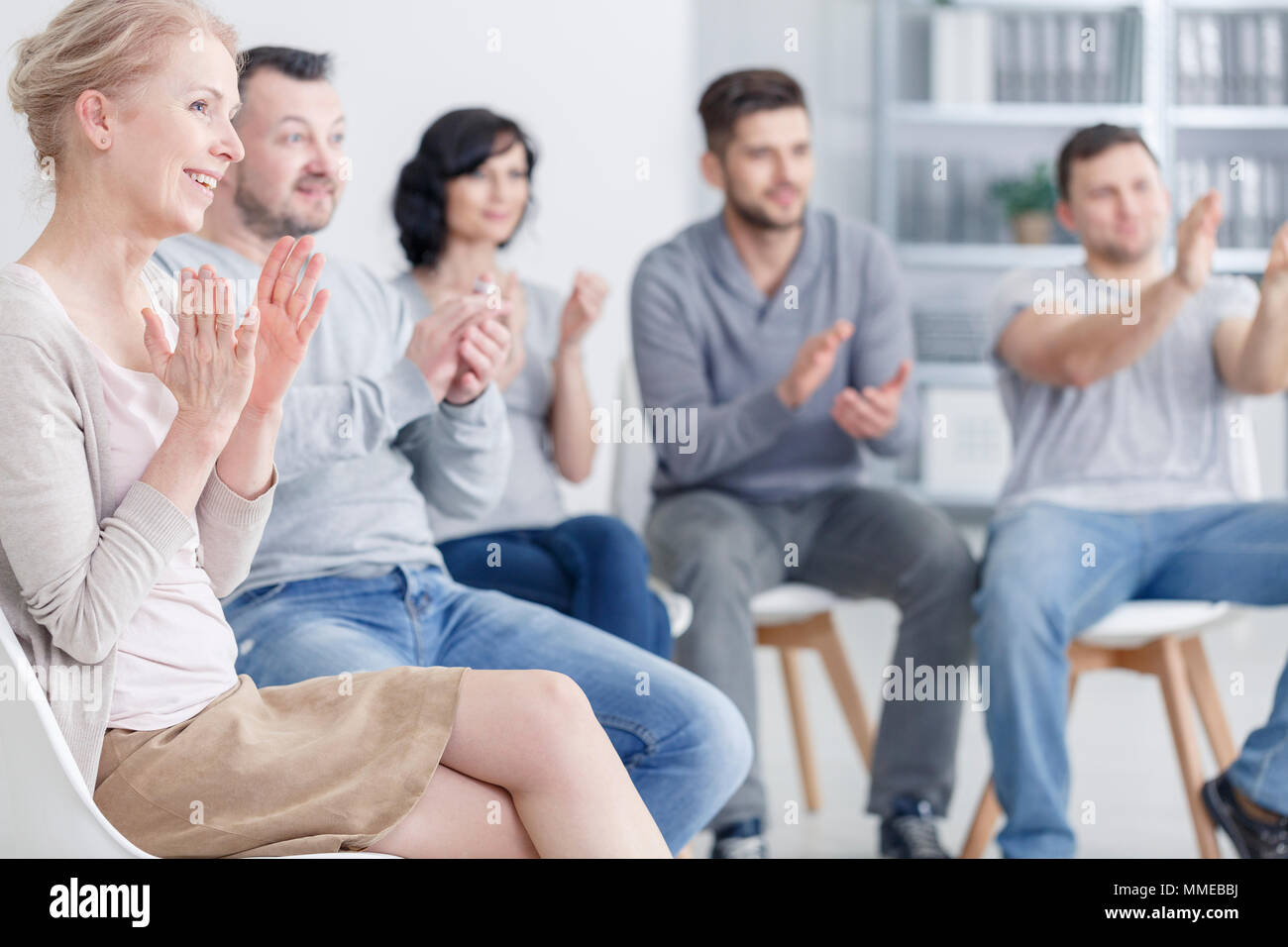Group therapy session clapping circle hi-res stock photography and ...
