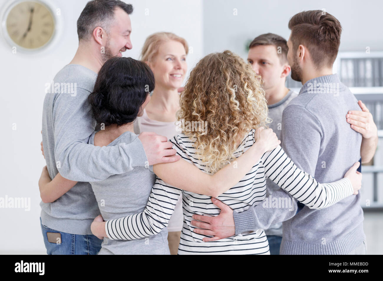 People having group hug during therapy in rehab Stock Photo - Alamy
