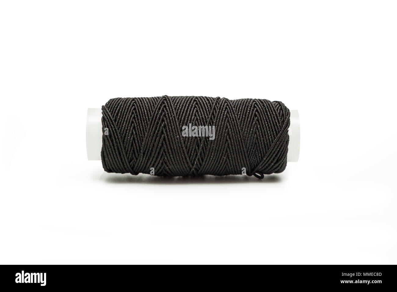 Black elastic thread on the coil horizontally isolated on white ...