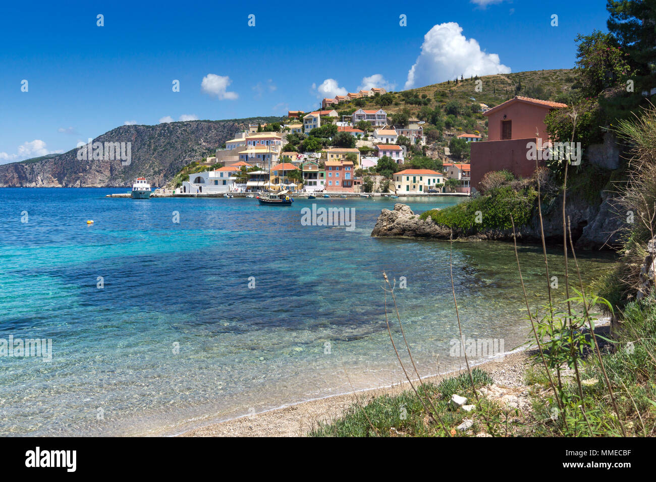 Beach of Assos village and beautiful sea bay, Kefalonia, Ionian islands ...