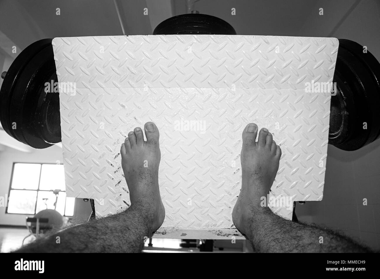 Man leg press gym Black and White Stock Photos & Images - Alamy