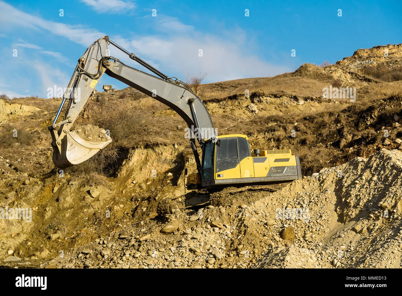 Construction site with excavator working with soil Stock Photo - Alamy