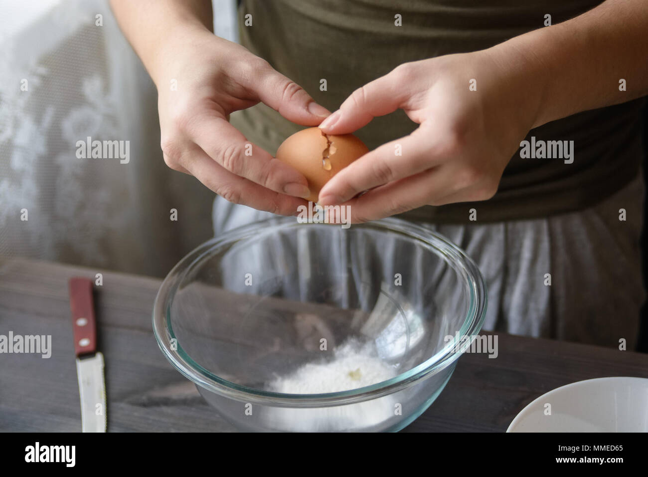 Preparing dough and recipe ingredients including eggs, flour, milk ...