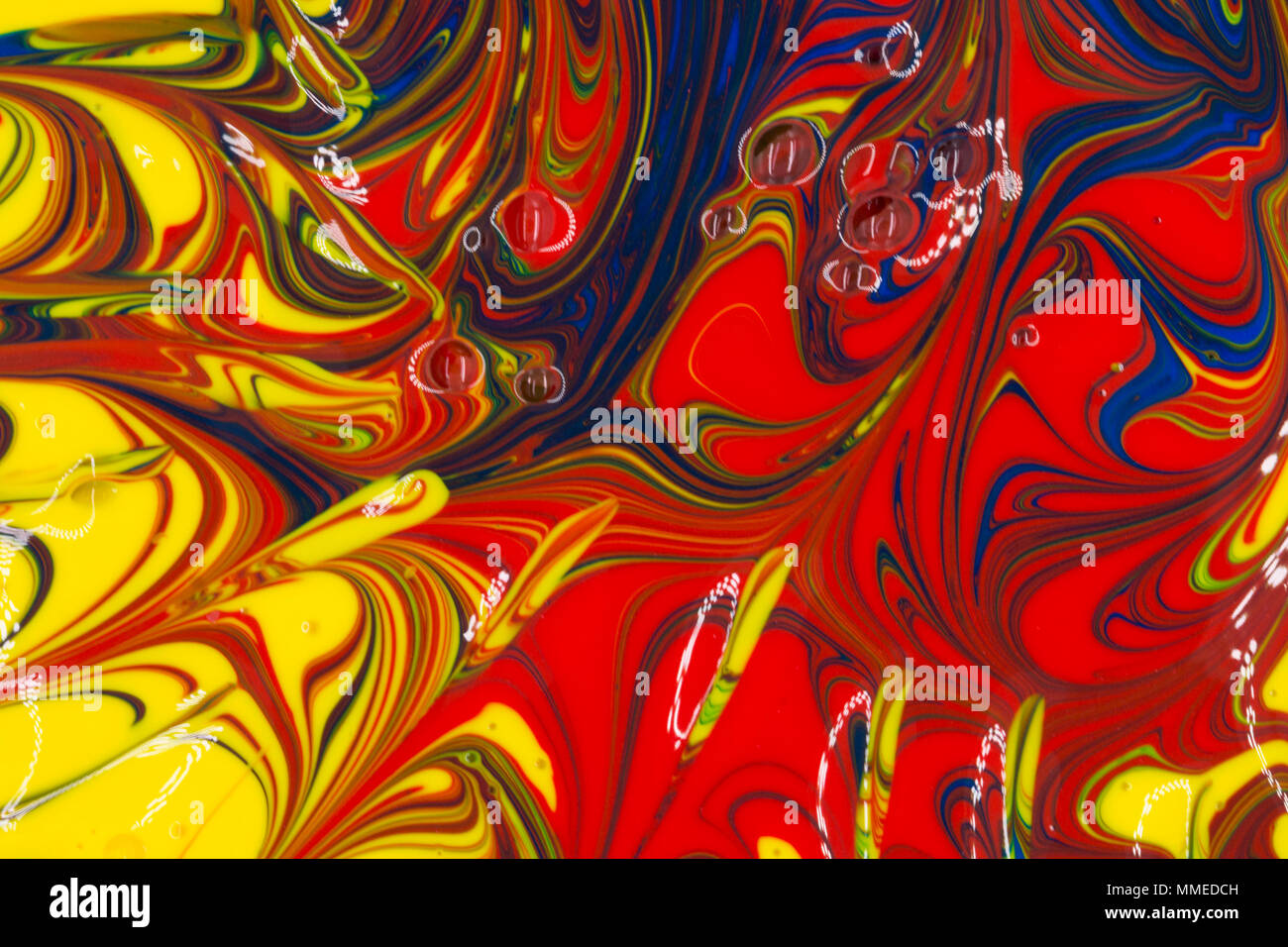 Abstract background of red yellow and blue paint splat / swirl Stock ...