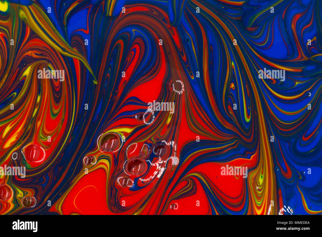 Abstract background of red yellow and blue paint splat / swirl Stock ...