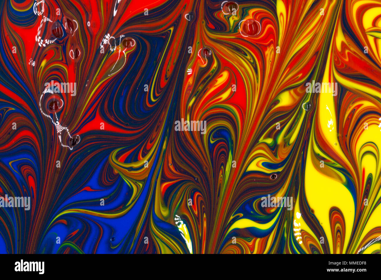 Abstract background of red yellow and blue paint splat / swirl Stock ...