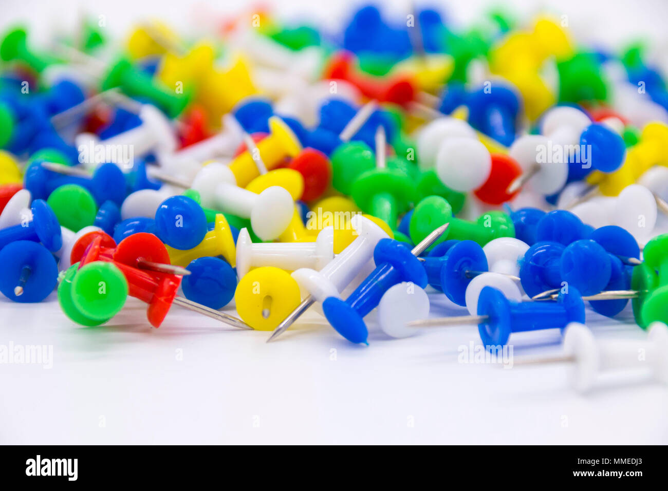 Pile of plastic notice board push pins on a white background Stock ...