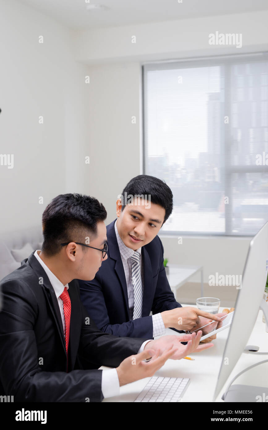 Startup business partners working together in desktop Stock Photo - Alamy