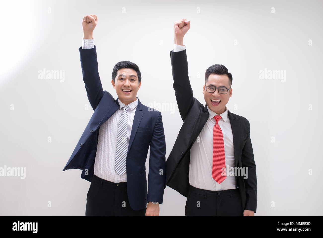 Successful Asian business man hands up feeling happy or win with ...
