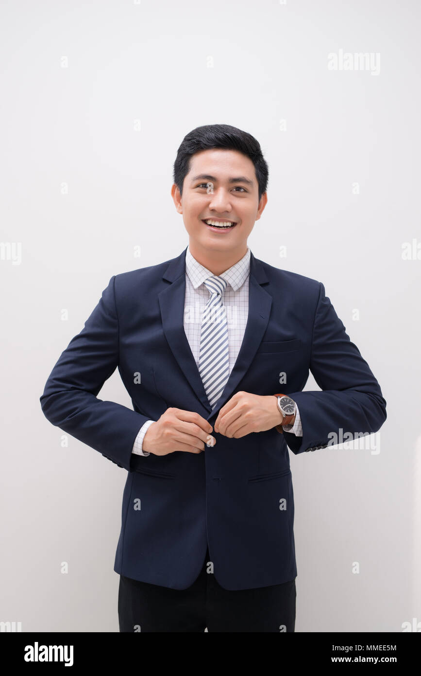 Young man putting on jacket hi-res stock photography and images - Alamy