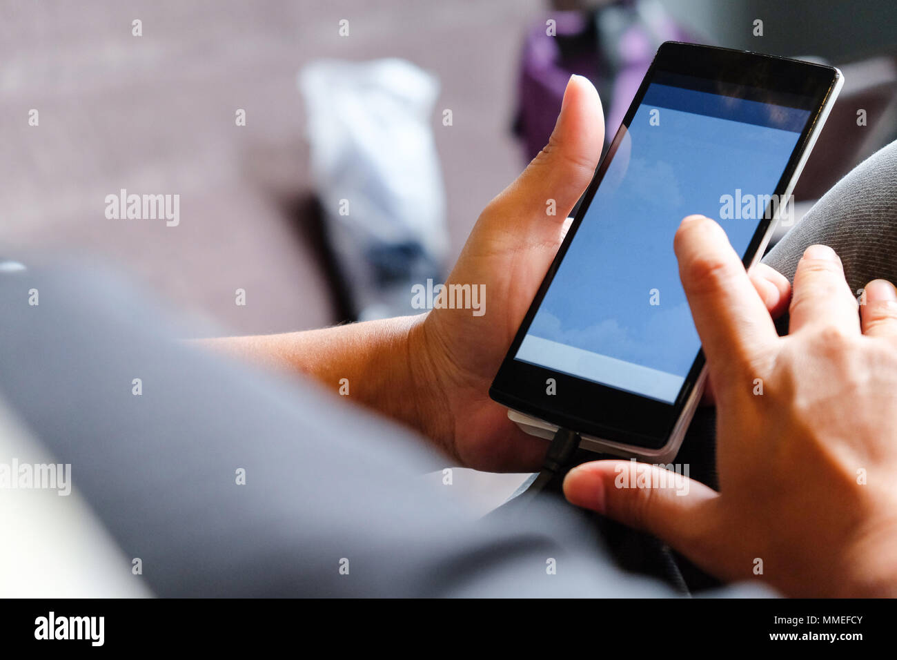 Rear view man watching smartphone hi-res stock photography and images ...