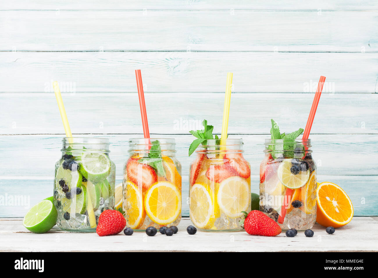 Fresh lemonade jar with summer fruits and berries. With space for your ...